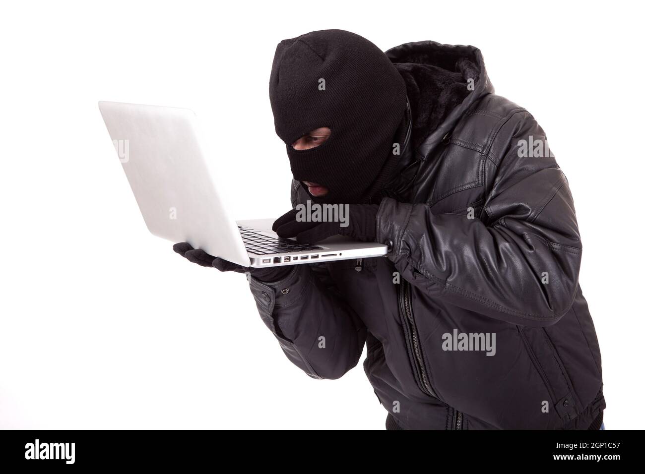 Disguised computer hacker hi-res stock photography and images - Alamy