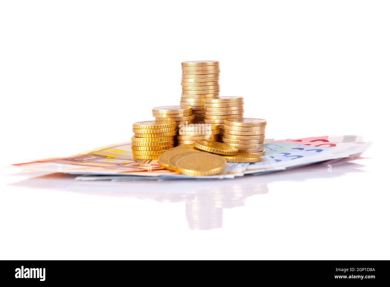 Pile of notes and coins Stock Photo - Alamy