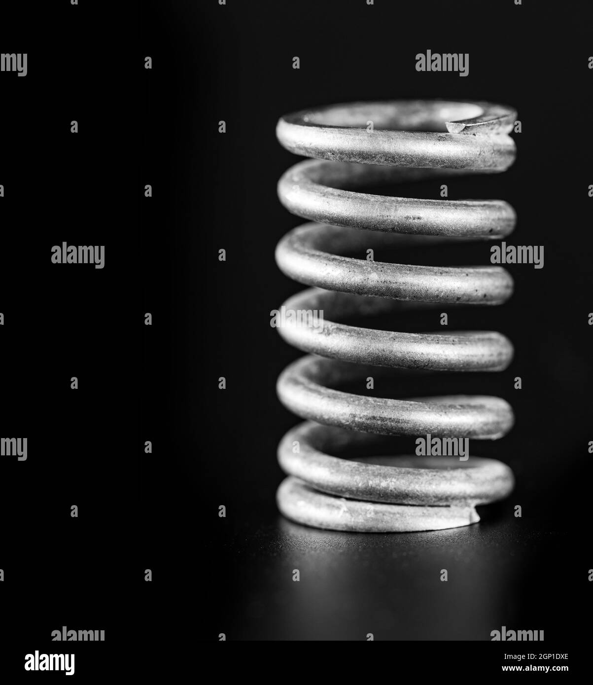 close up metal spring on black background Stock Photo - Alamy