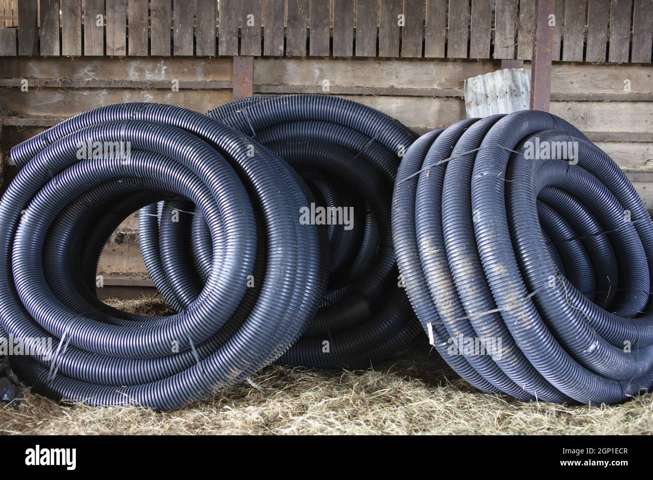 Coils of perforated land drainage pipe Stock Photo - Alamy