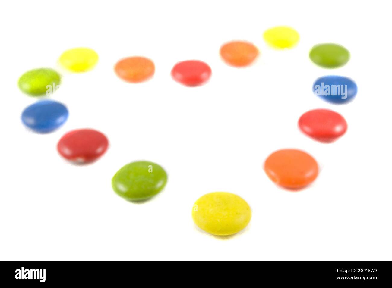 heart made of colored smarties, focus on the first one Stock Photo - Alamy