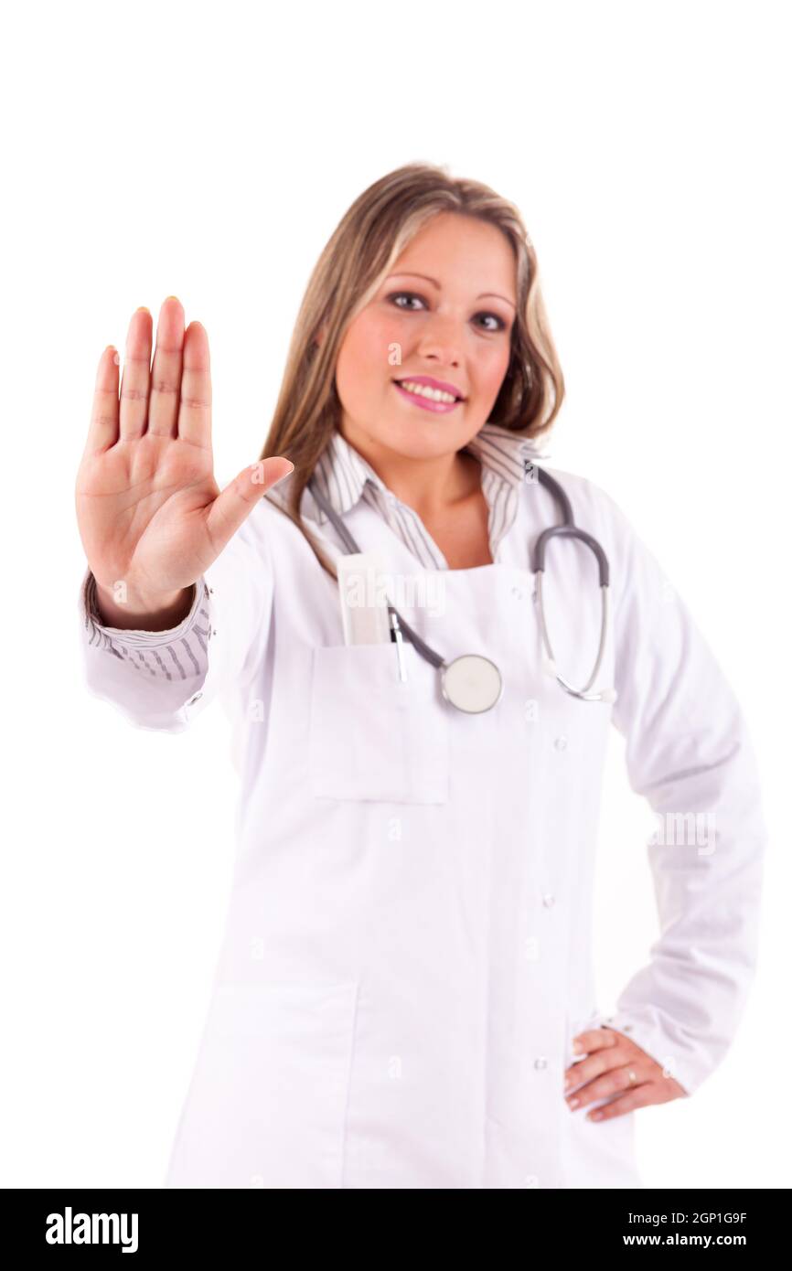 Young nurse making stop sign - isolated over white Stock Photo - Alamy