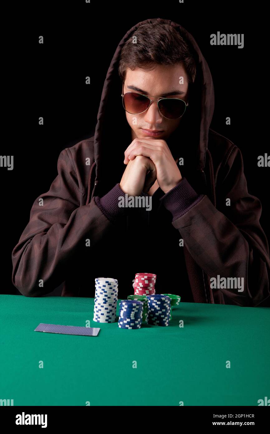 Young handsome man playing texas hold'em poker Stock Photo - Alamy