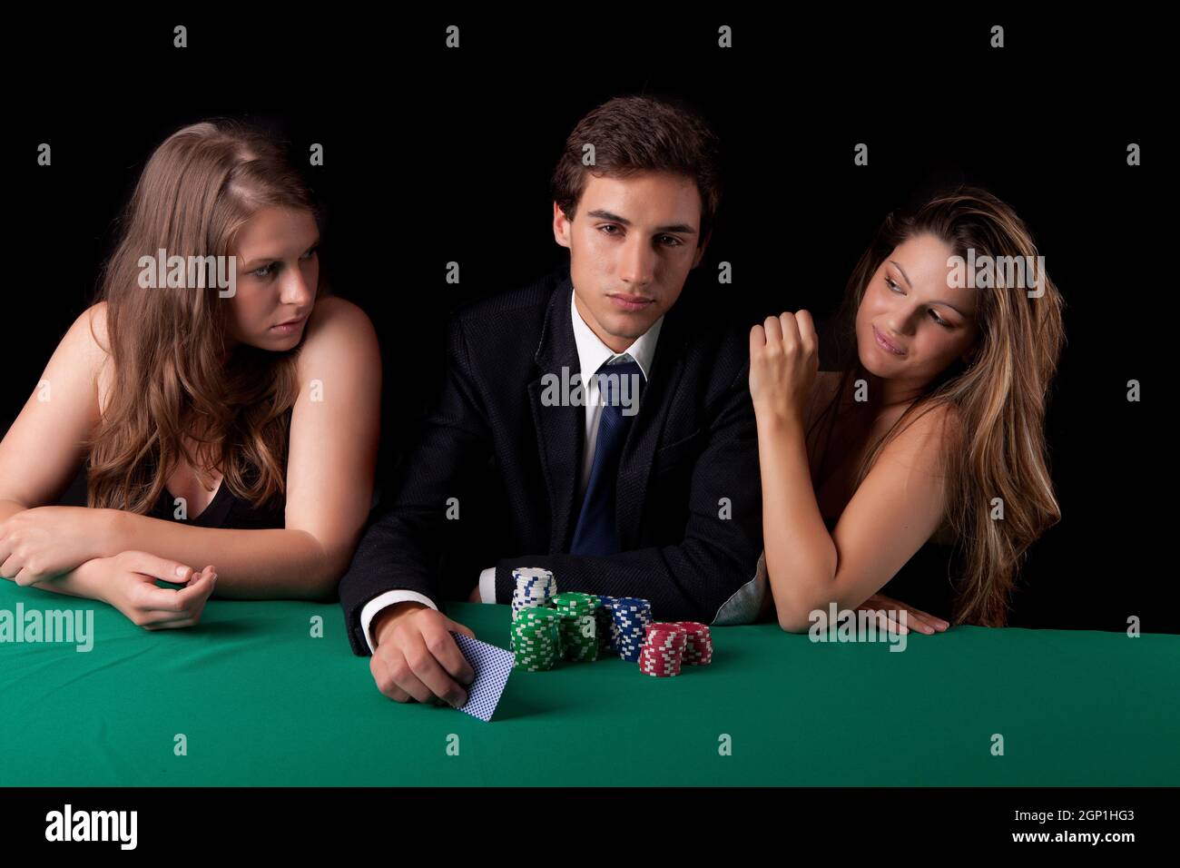 Young handsome man playing texas hold'em poker Stock Photo - Alamy
