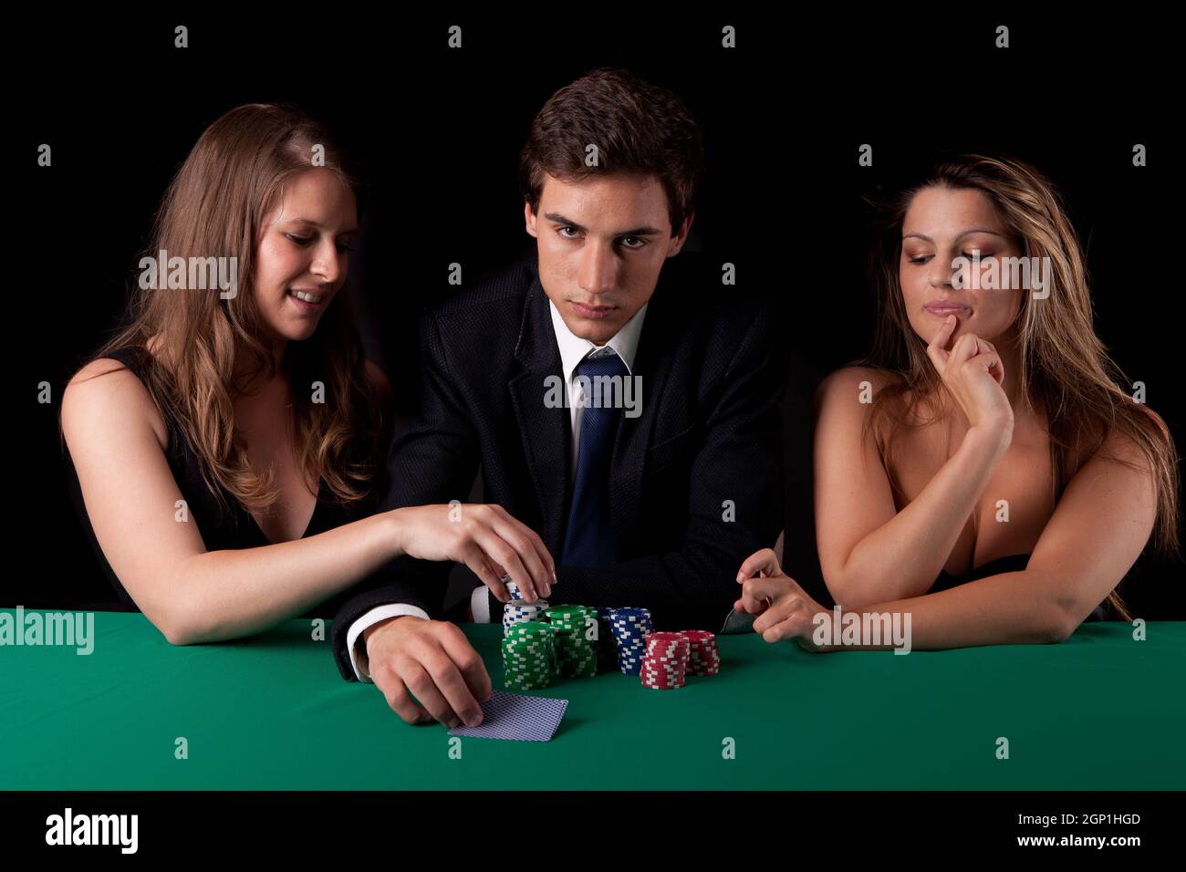 Young handsome man playing texas hold'em poker Stock Photo - Alamy