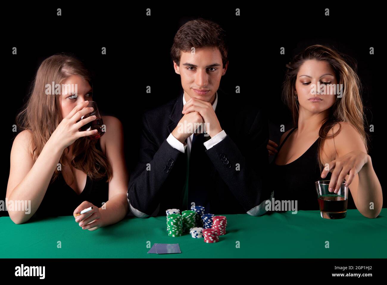 Young handsome man playing texas hold'em poker Stock Photo - Alamy