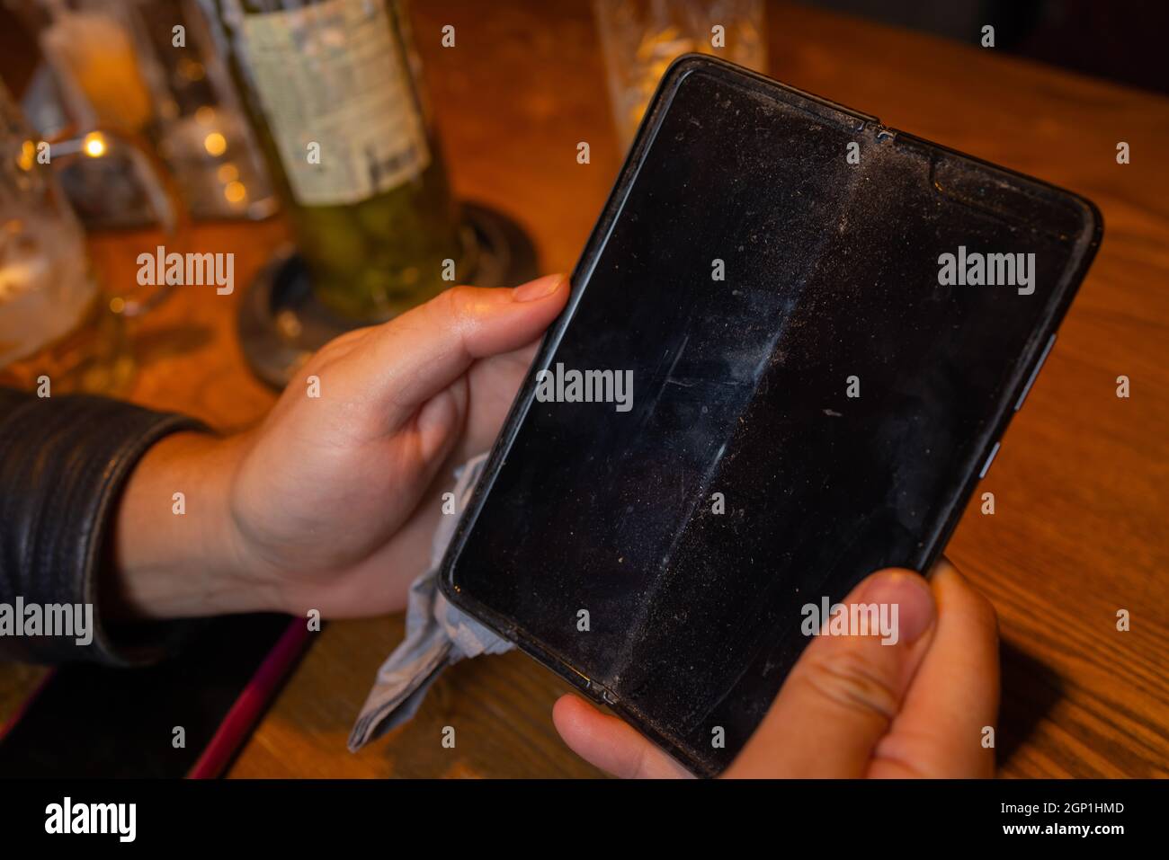Folded desk and chair and screen broken smartphone Image of bullying ...
