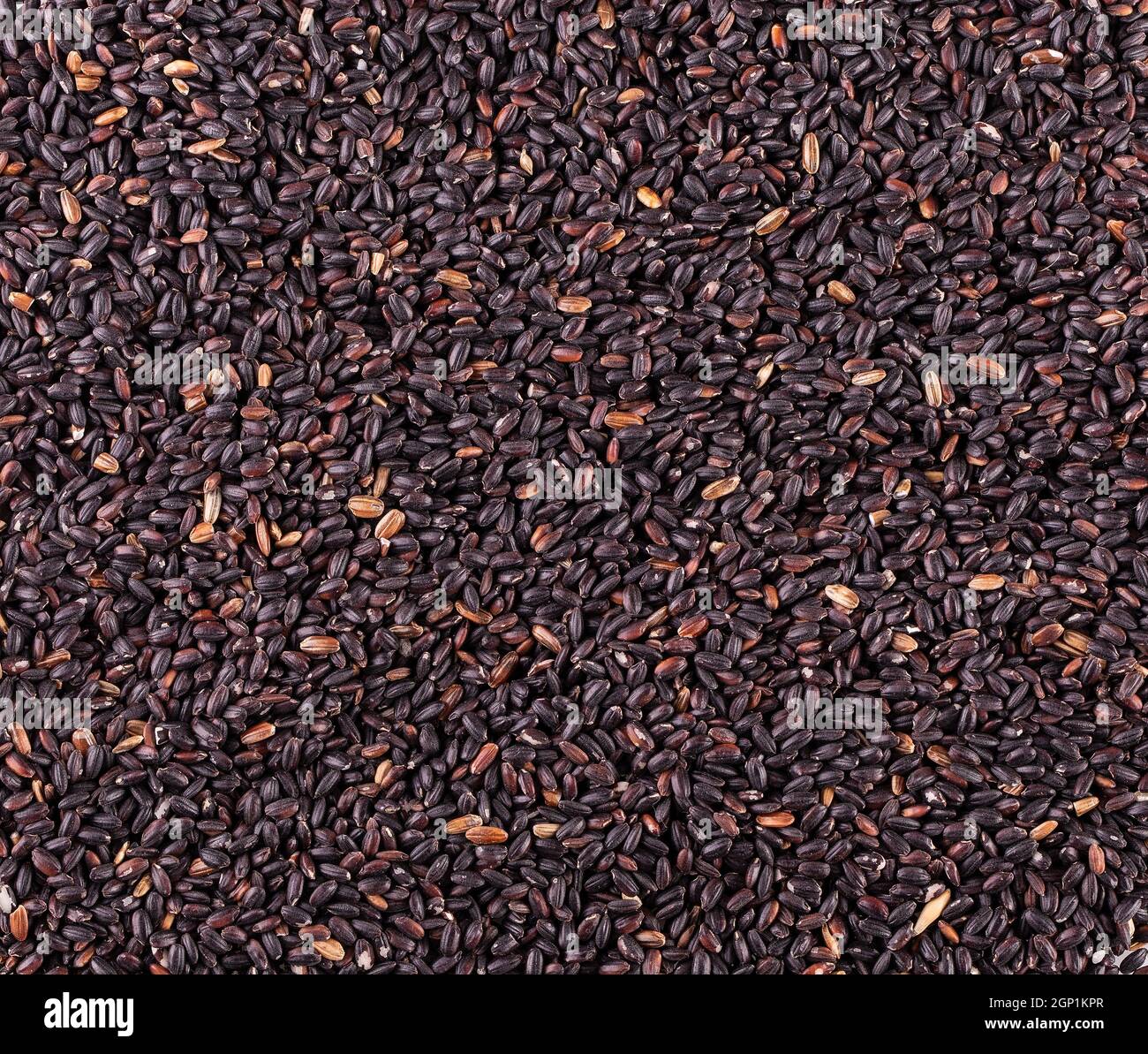 raw black rice as background. Clipping path Stock Photo - Alamy