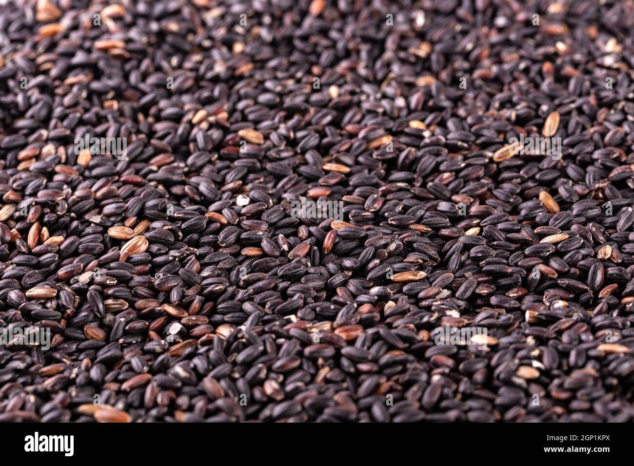 raw black rice as background. Clipping path Stock Photo - Alamy