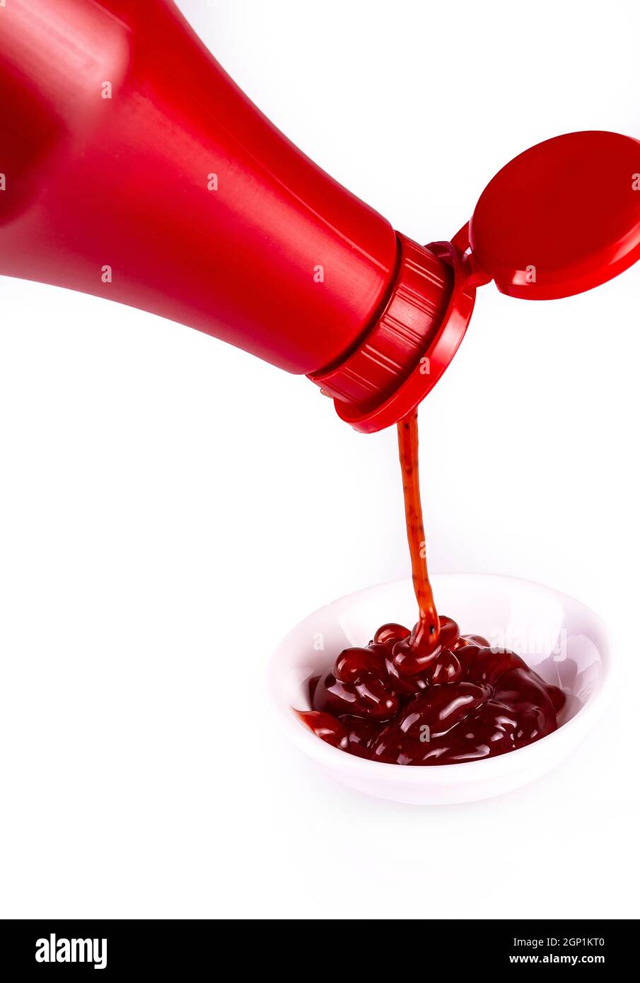 pouring ketchup from bottle on white background Stock Photo - Alamy
