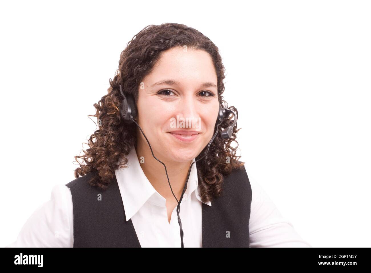 Friendly telephone operator posing isolated over white Stock Photo - Alamy