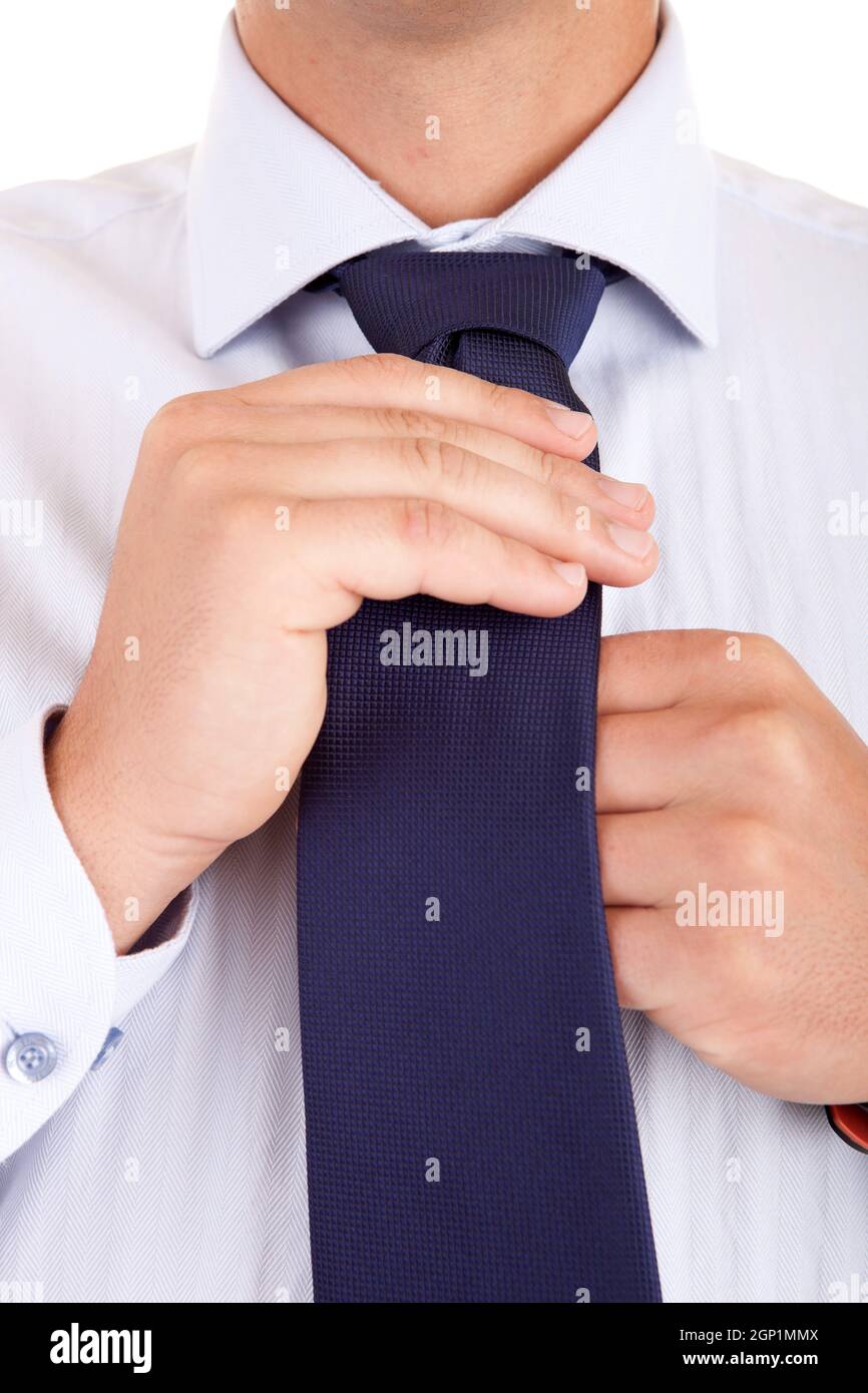 Business man fixing his tie, isolated over white Stock Photo - Alamy
