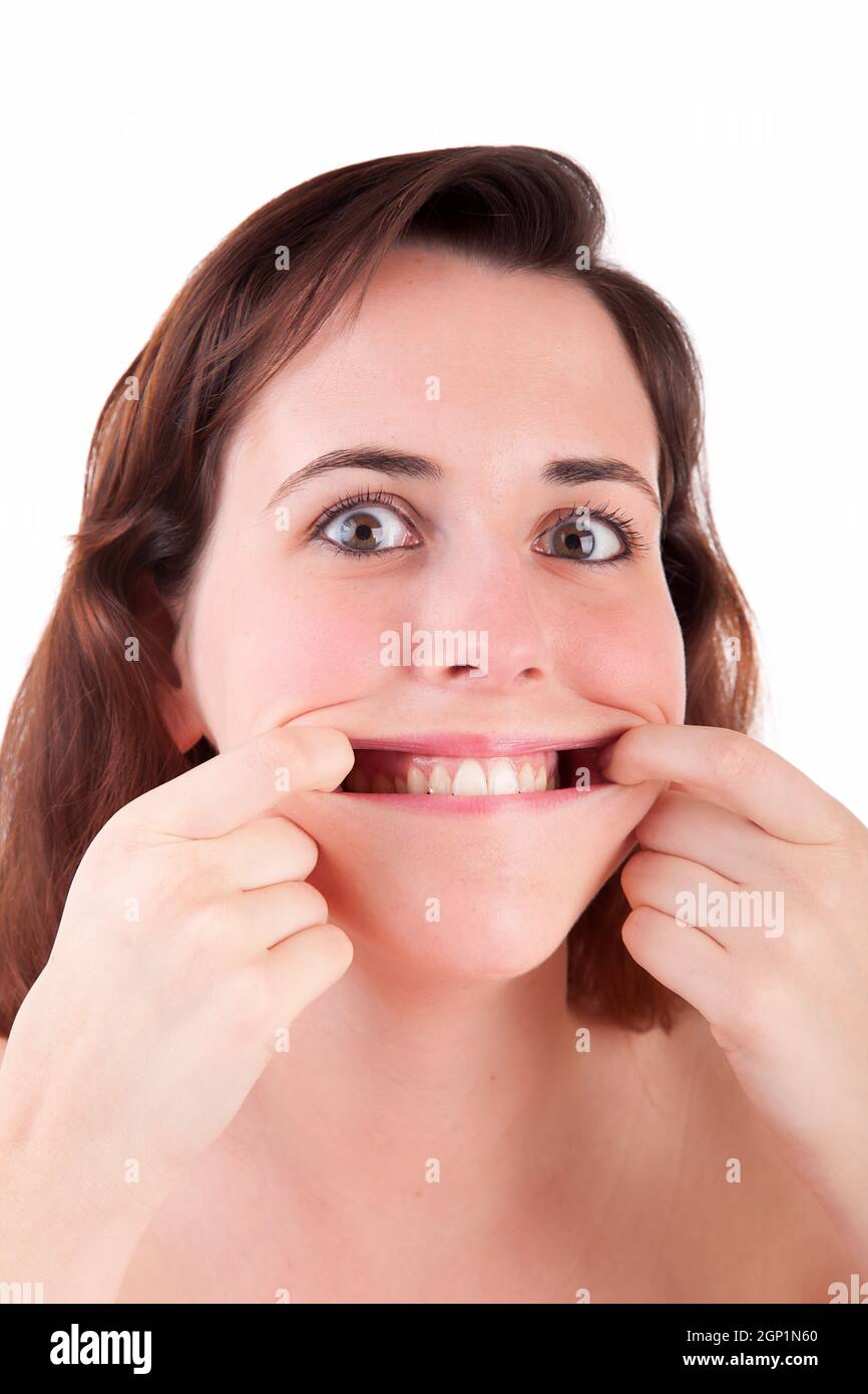 Silly woman posing isolated over white background Stock Photo - Alamy