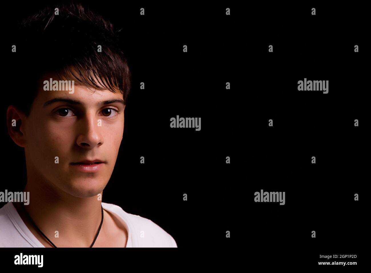 Young boy portrait - low key portrait Stock Photo - Alamy