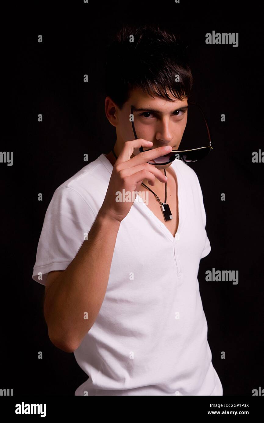 Young boy with sunglasses - low key portrait Stock Photo - Alamy