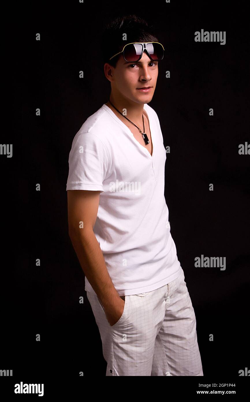 Young boy low key portrait - isolated over black Stock Photo - Alamy