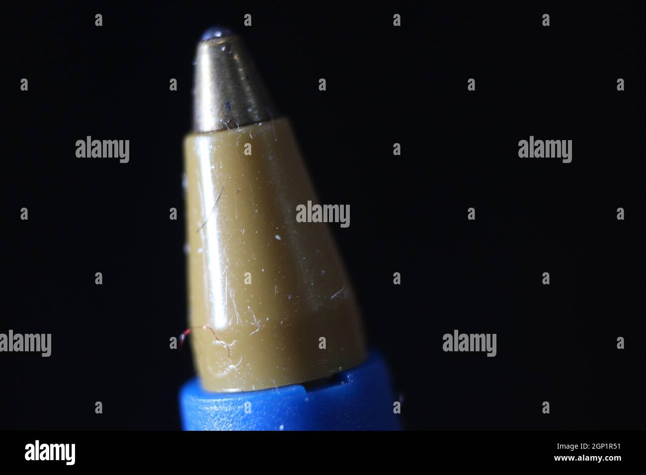 Macro photo of ballpoint pen tip with dark grey background. Extreme ...