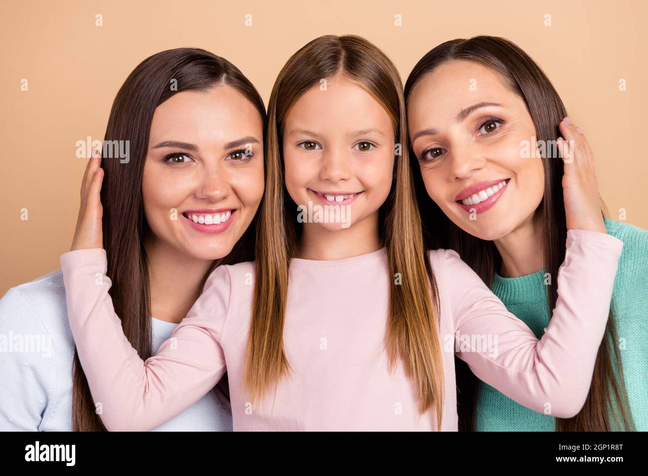 Portrait of three attractive cheerful tender sweet affectionate girls ...