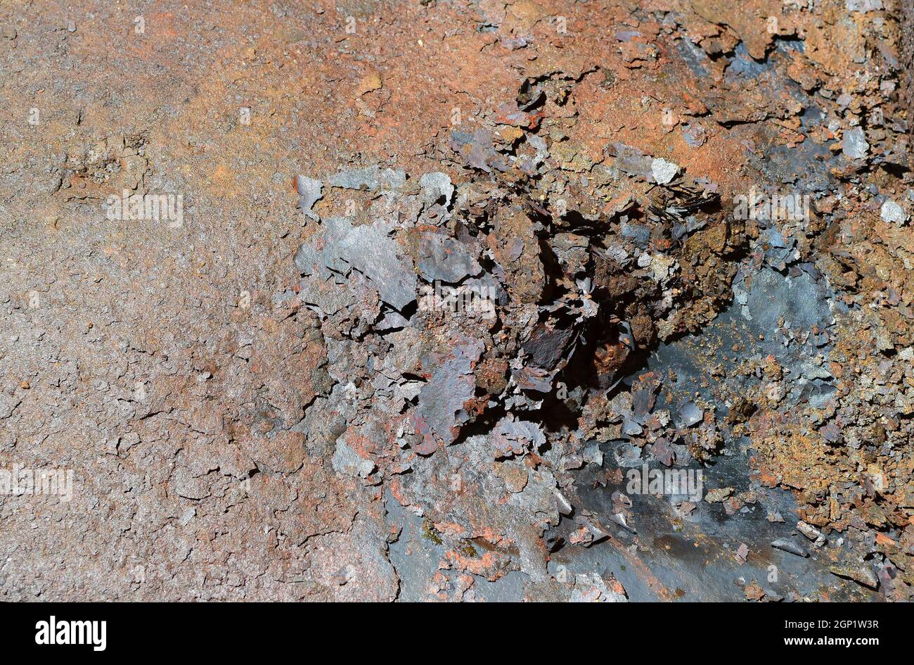 Flakes of rust on a sheet of rusty iron. Background of rust. Corrosion ...