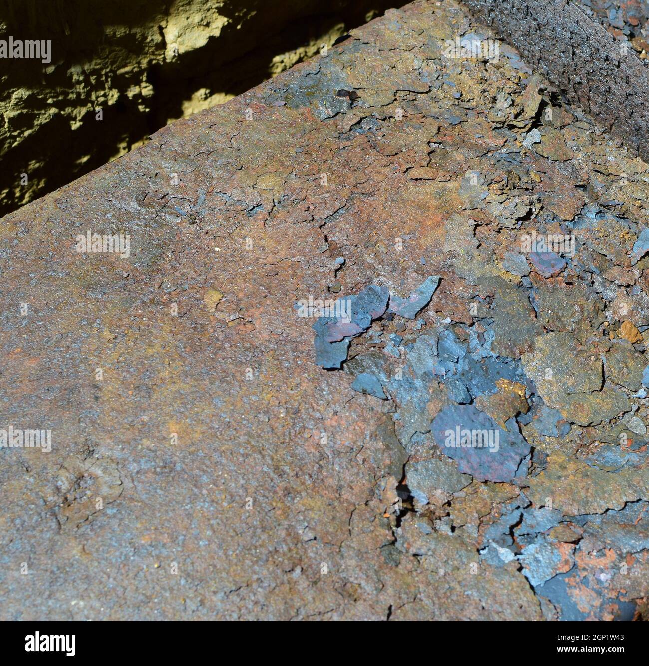 Flakes of rust on a sheet of rusty iron. Background of rust. Corrosion ...