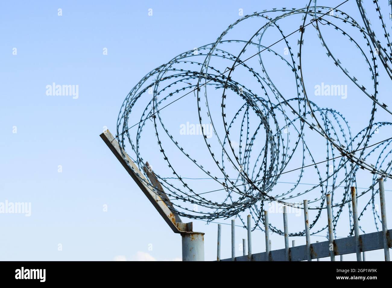 Barbed wire on the fence. Protective fencing specially protected object ...