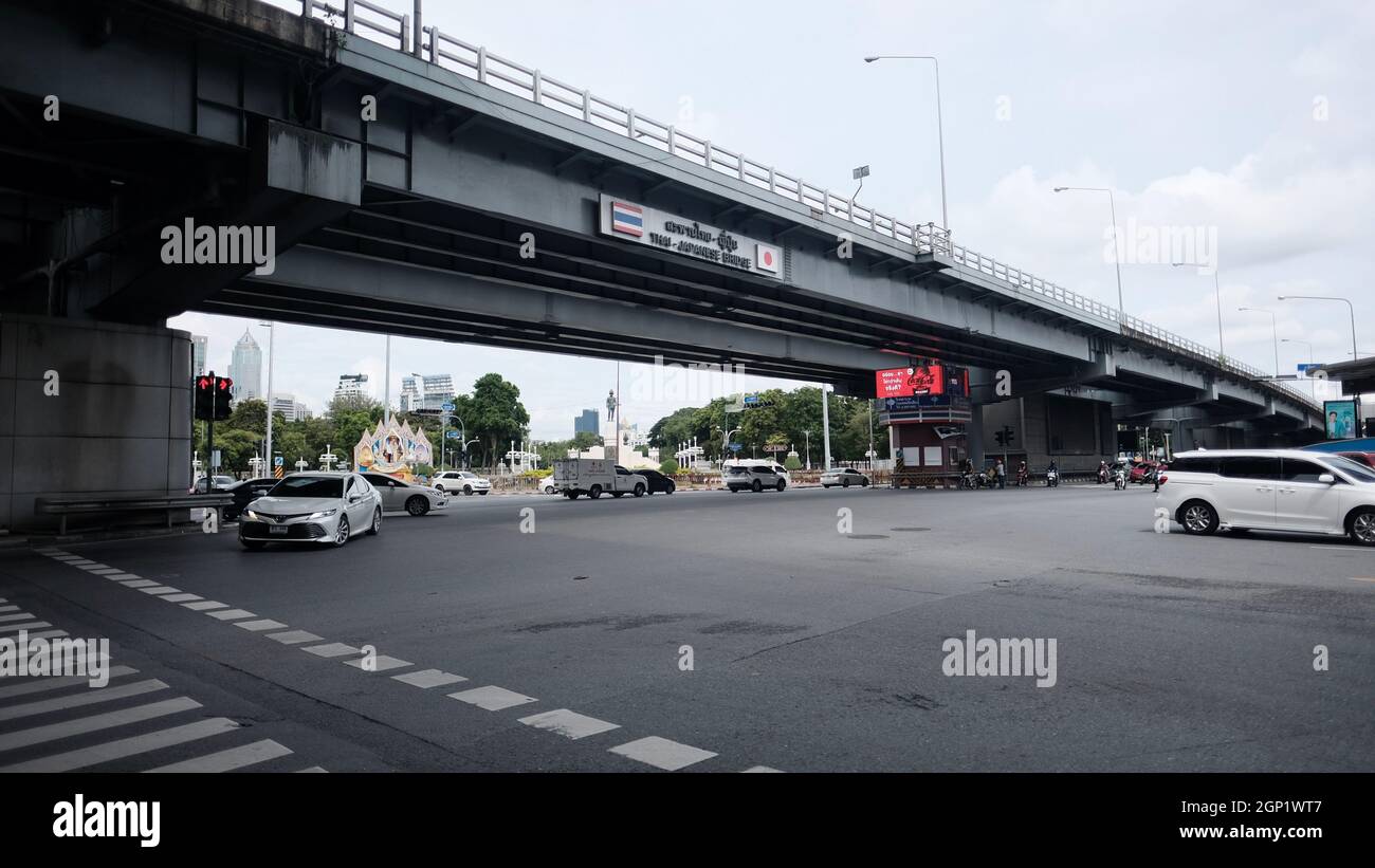 Street traffic at Intersection of Silom Road and Rama IV Road with Thai ...