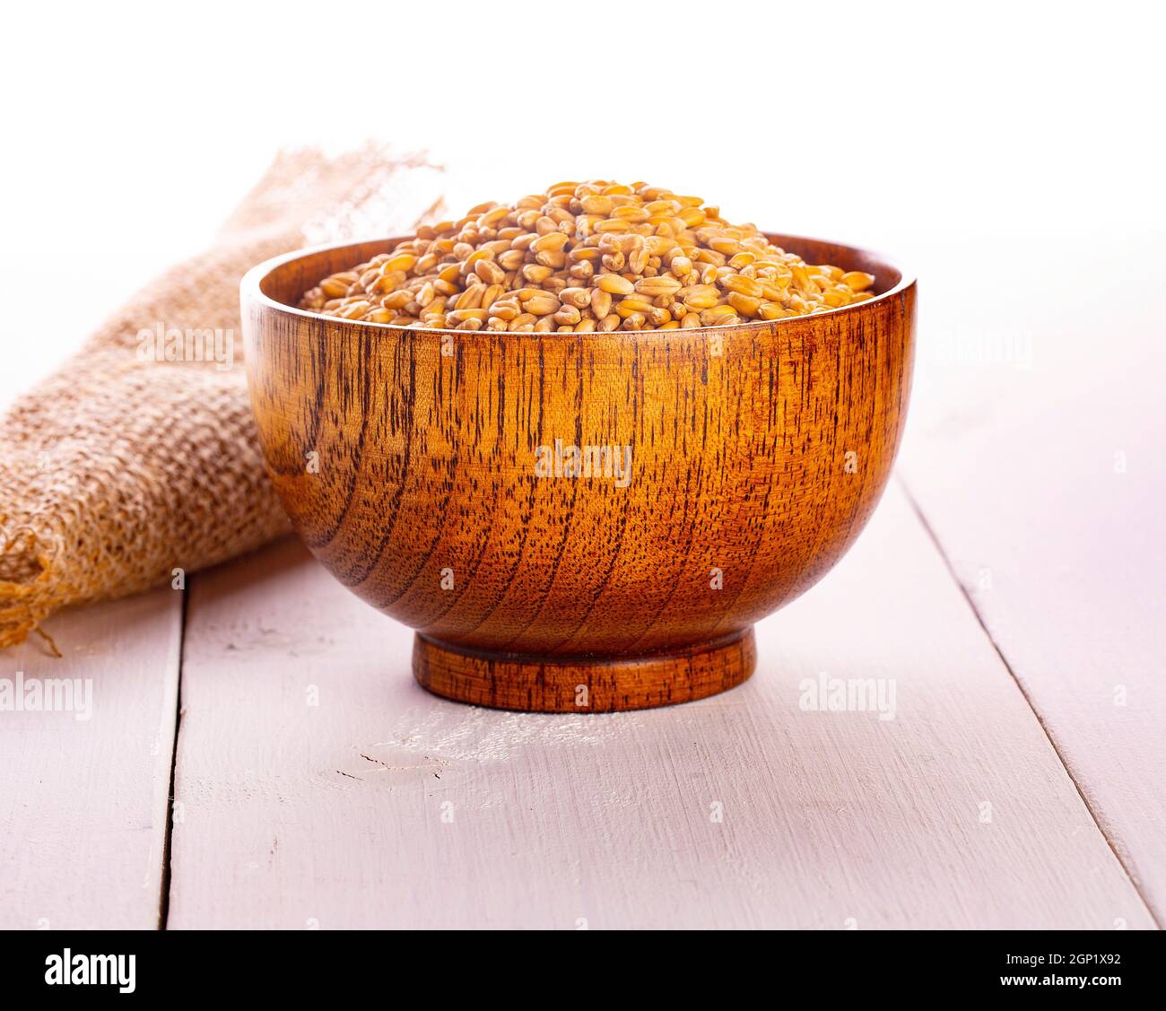 Dry wheat seeds, grains in wooden bowl Stock Photo - Alamy