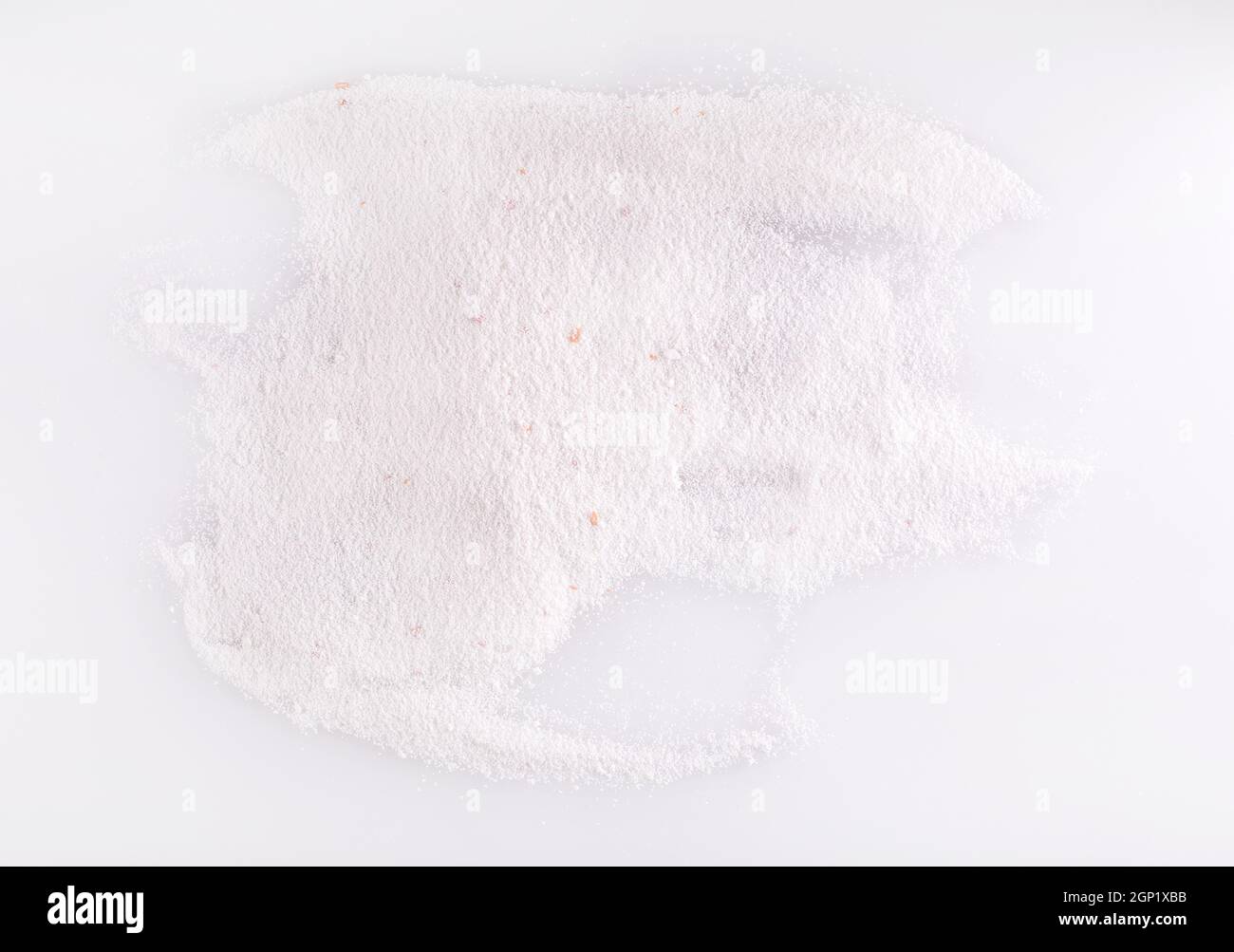 Washing powder pile isolated on white background Stock Photo - Alamy