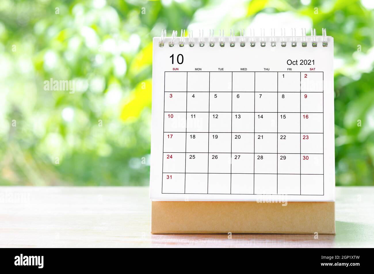 October 2021 Calendar desk for organizer to plan and reminder on wooden ...