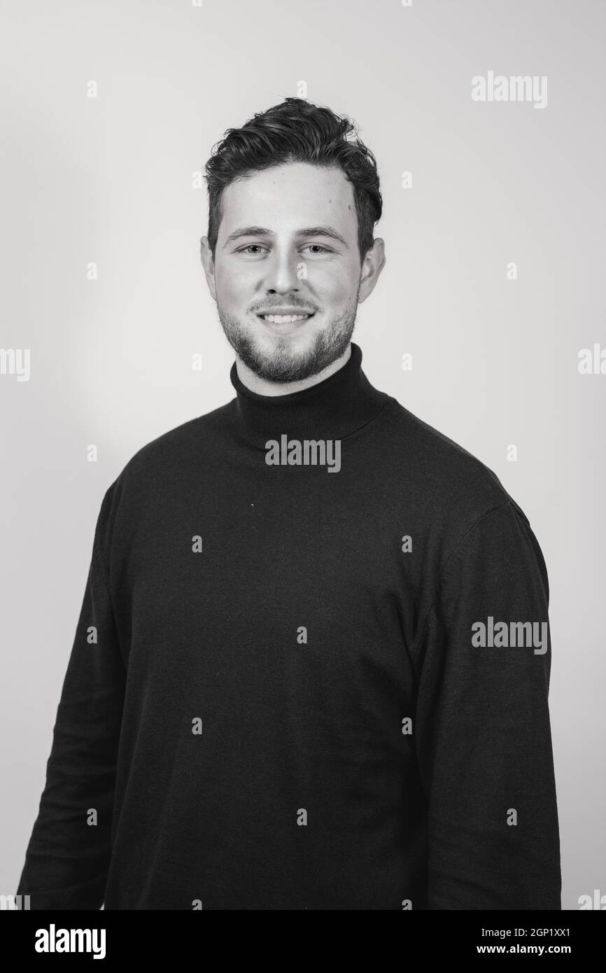Grayscale shot of a young cheerful Bosnian man Stock Photo - Alamy