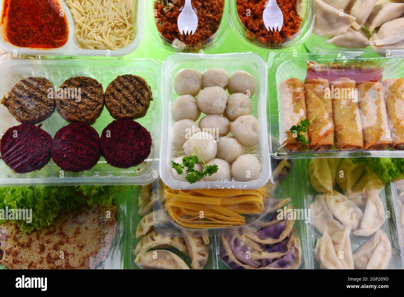 A variety of prepackaged food products in plastic boxes Stock Photo - Alamy
