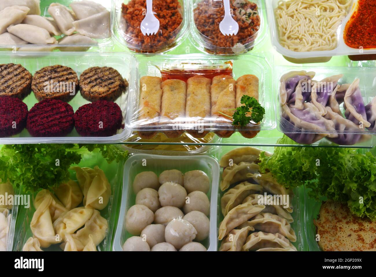 A variety of prepackaged food products in plastic boxes Stock Photo - Alamy