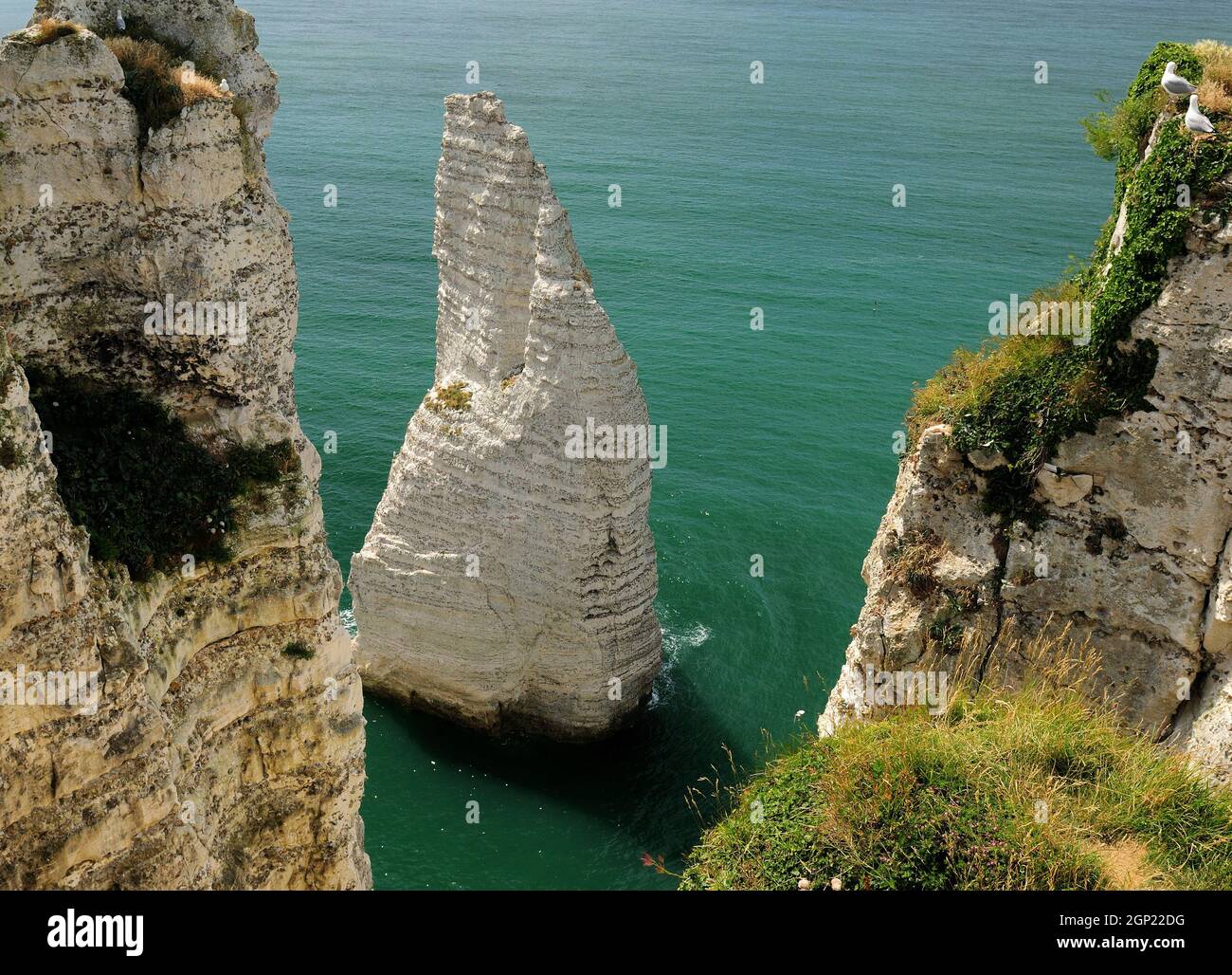Sea Stack In The Green Shimmering Sea At The Steep Chalk Cliff Coast Of ...