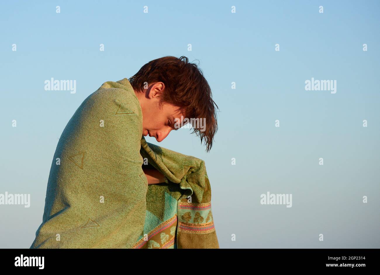 The young man drying himself with the towel Stock Photo - Alamy
