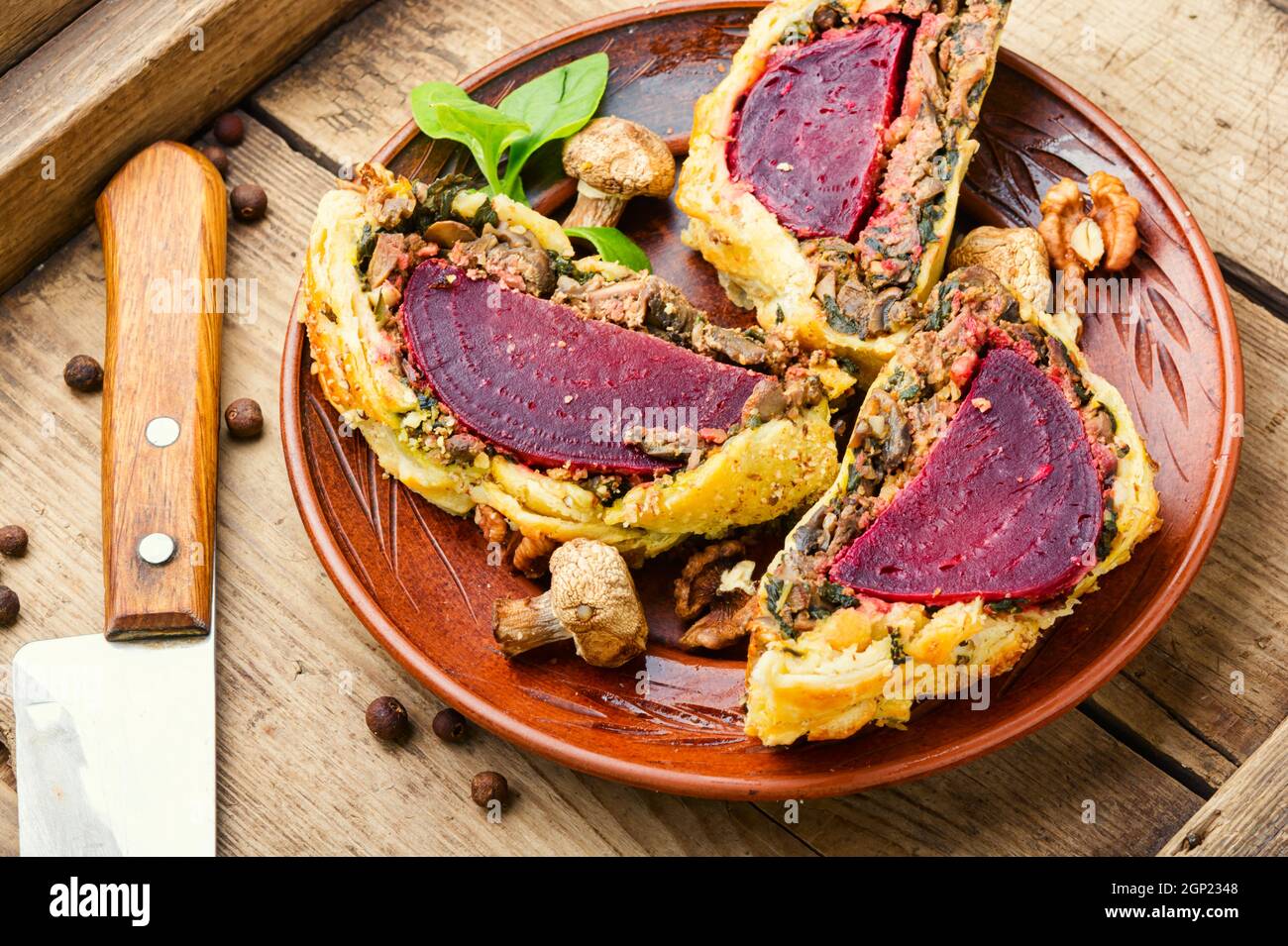 Delicious beetroot pie sliced on a plate.Wellington vegetable pie Stock ...