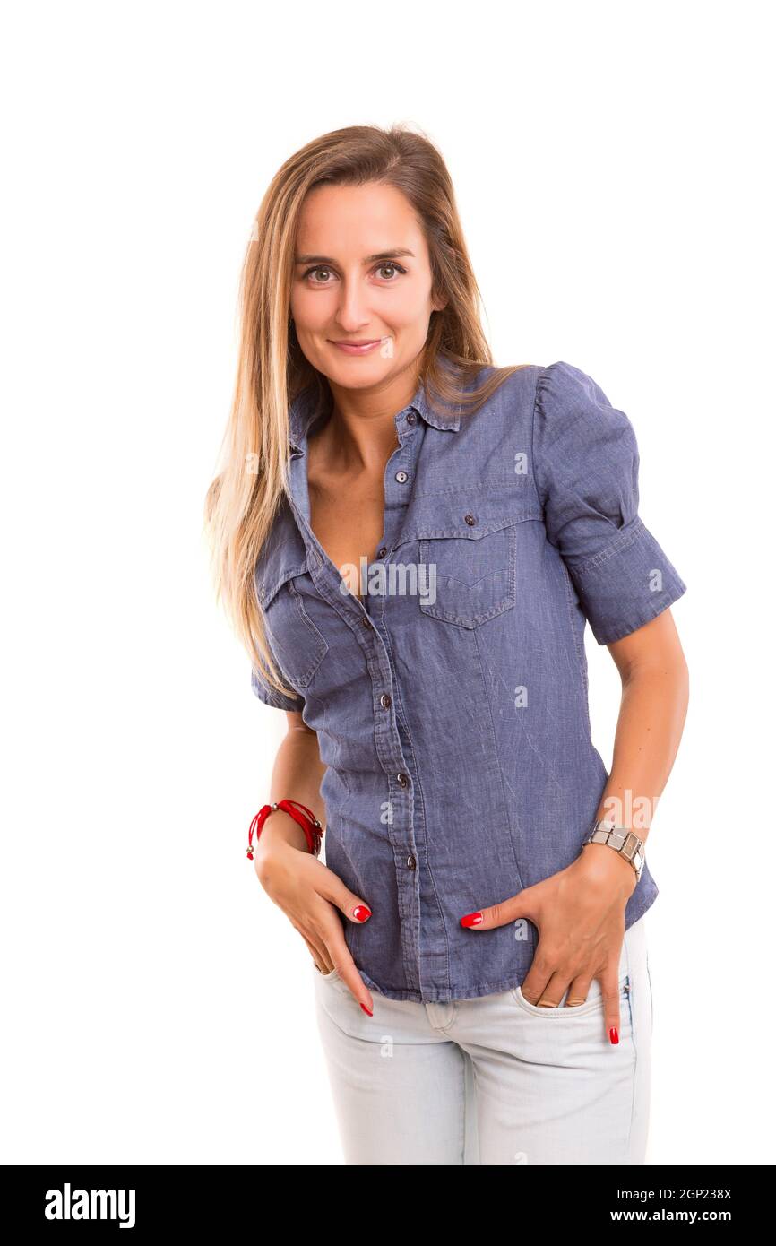 A very beautiful young woman posing isolated over copy space background ...