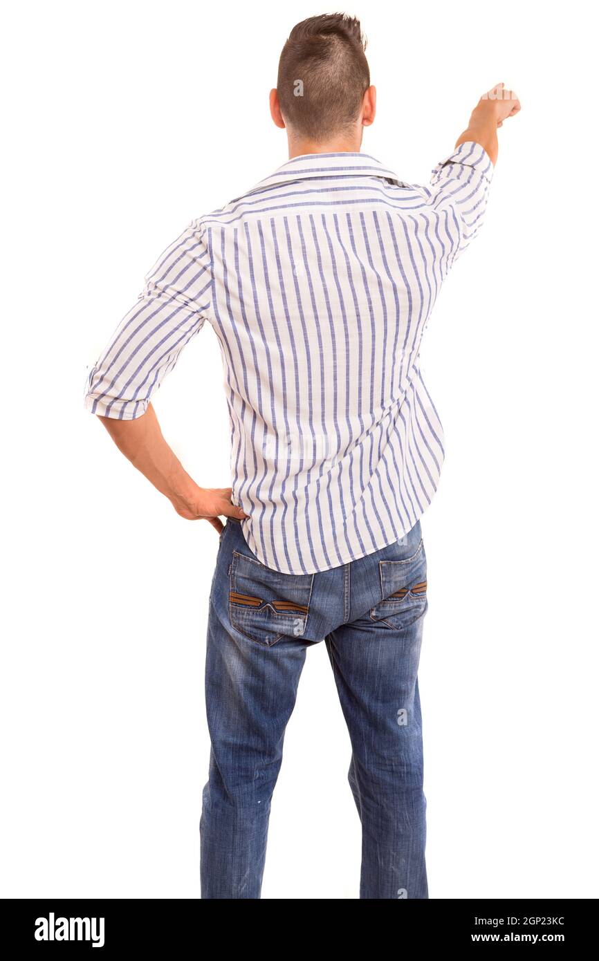 A young man with his back turned to camera, pointing to something Stock ...
