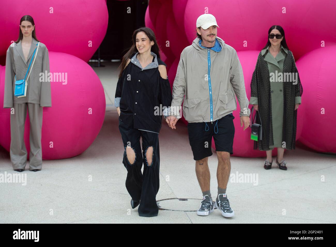 Fashion designers Victoria Feldman and Tomas Berzins acknowledge the ...