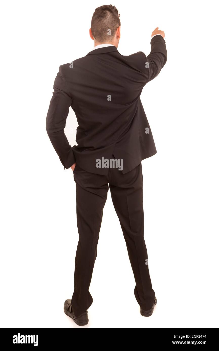 A young man with his back turned to camera, pointing to something Stock ...