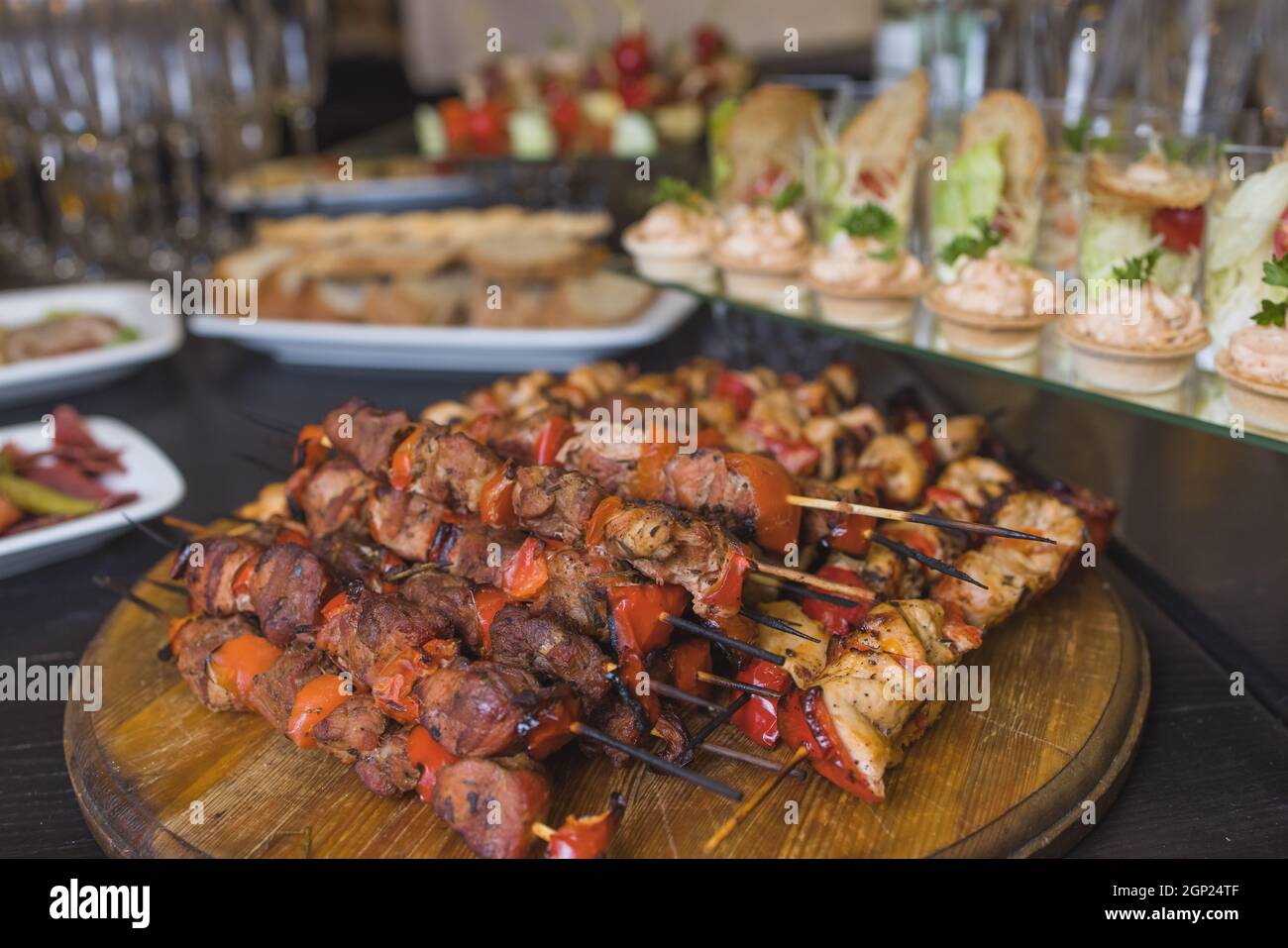 Assorted meat on a plate close up. Different types of meat and potatoes ...