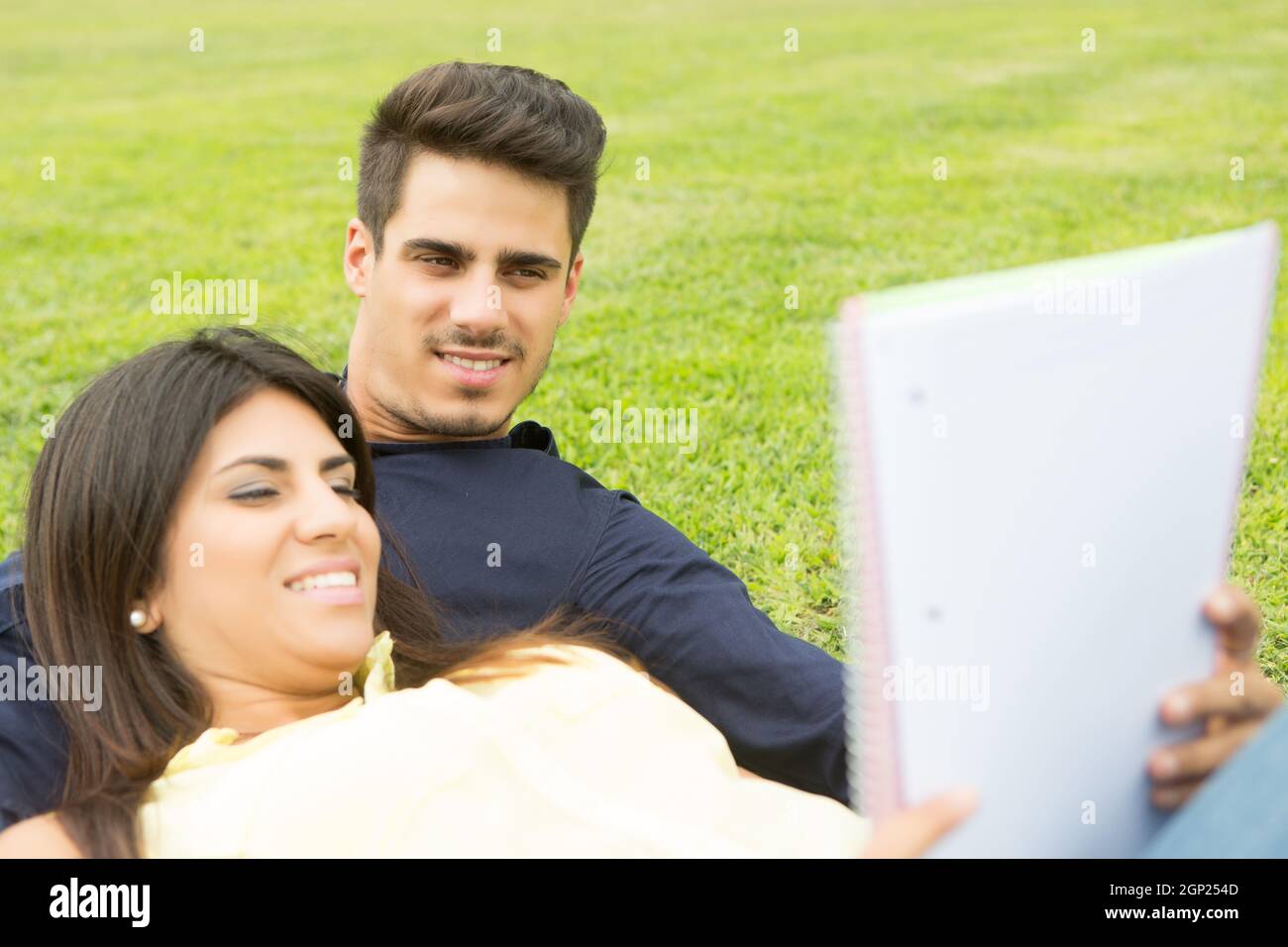 Couple of happy students at the university campus Stock Photo - Alamy