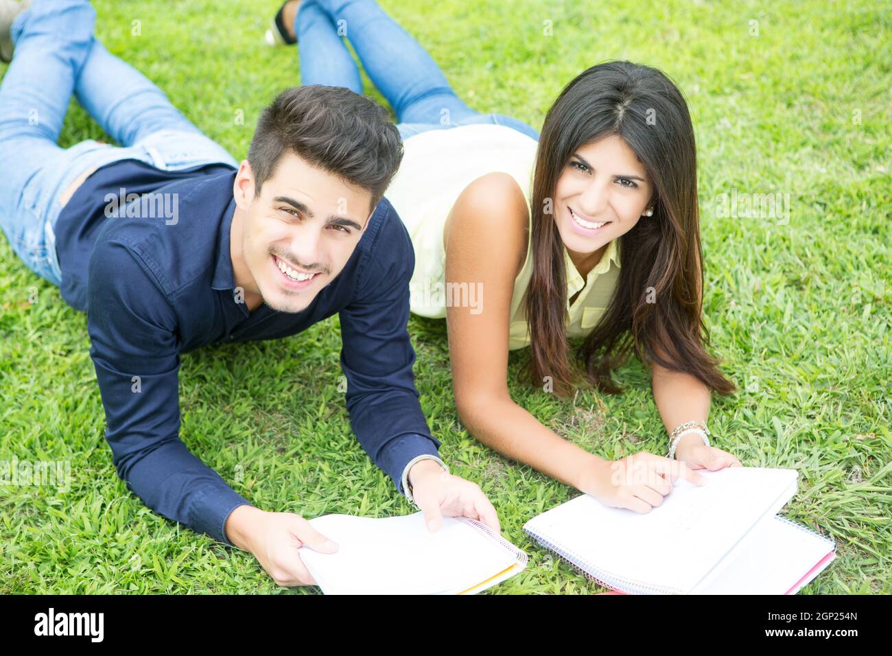 Couple of happy students at the university campus Stock Photo - Alamy