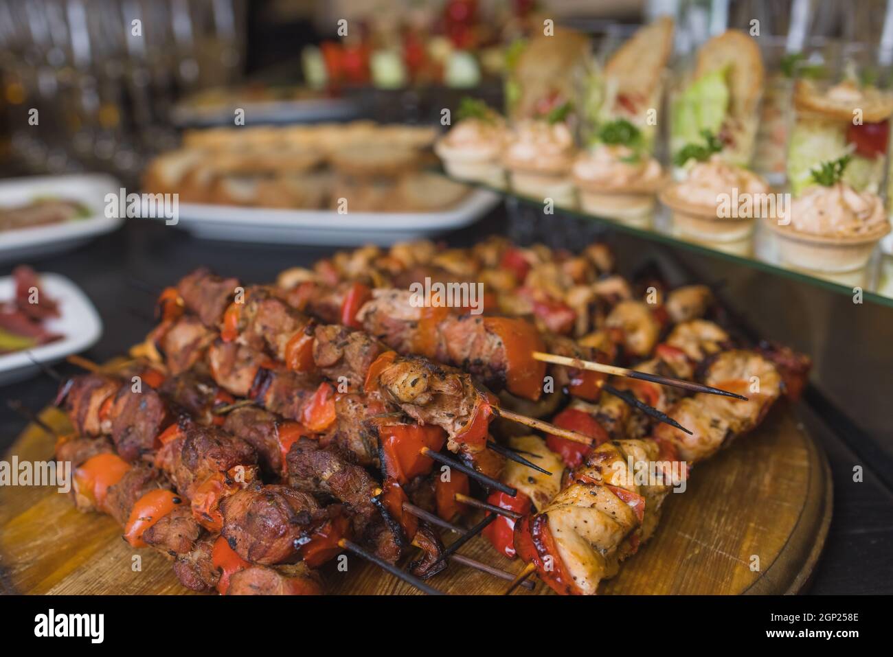 Assorted meat on a plate close up. Different types of meat and potatoes ...