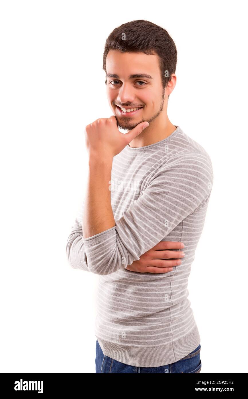 Studio picture of a young and handsome man posing isolated Stock Photo ...