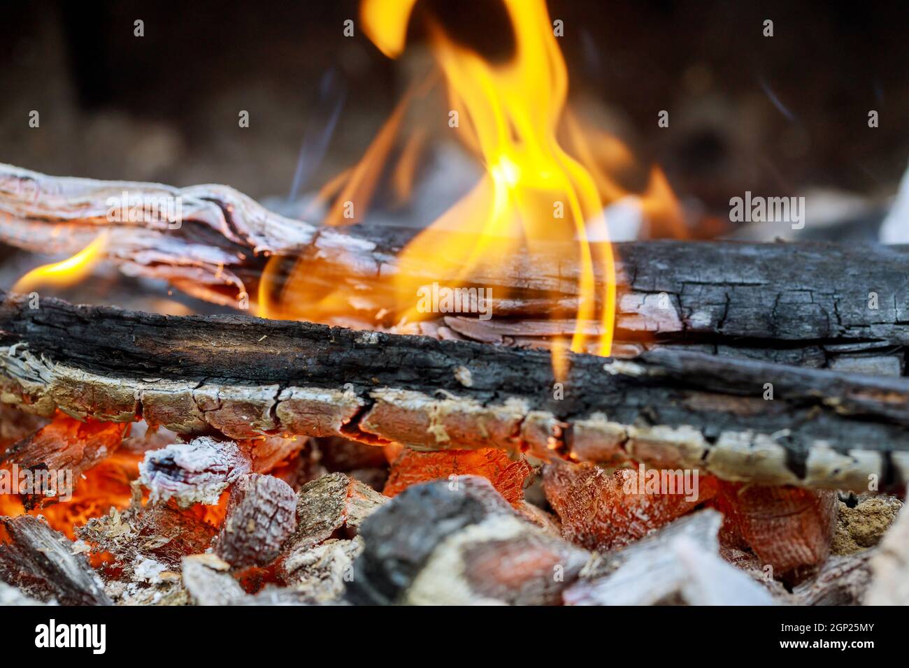 Fire in fireplace with logs and flames at home of burning wood logs ...