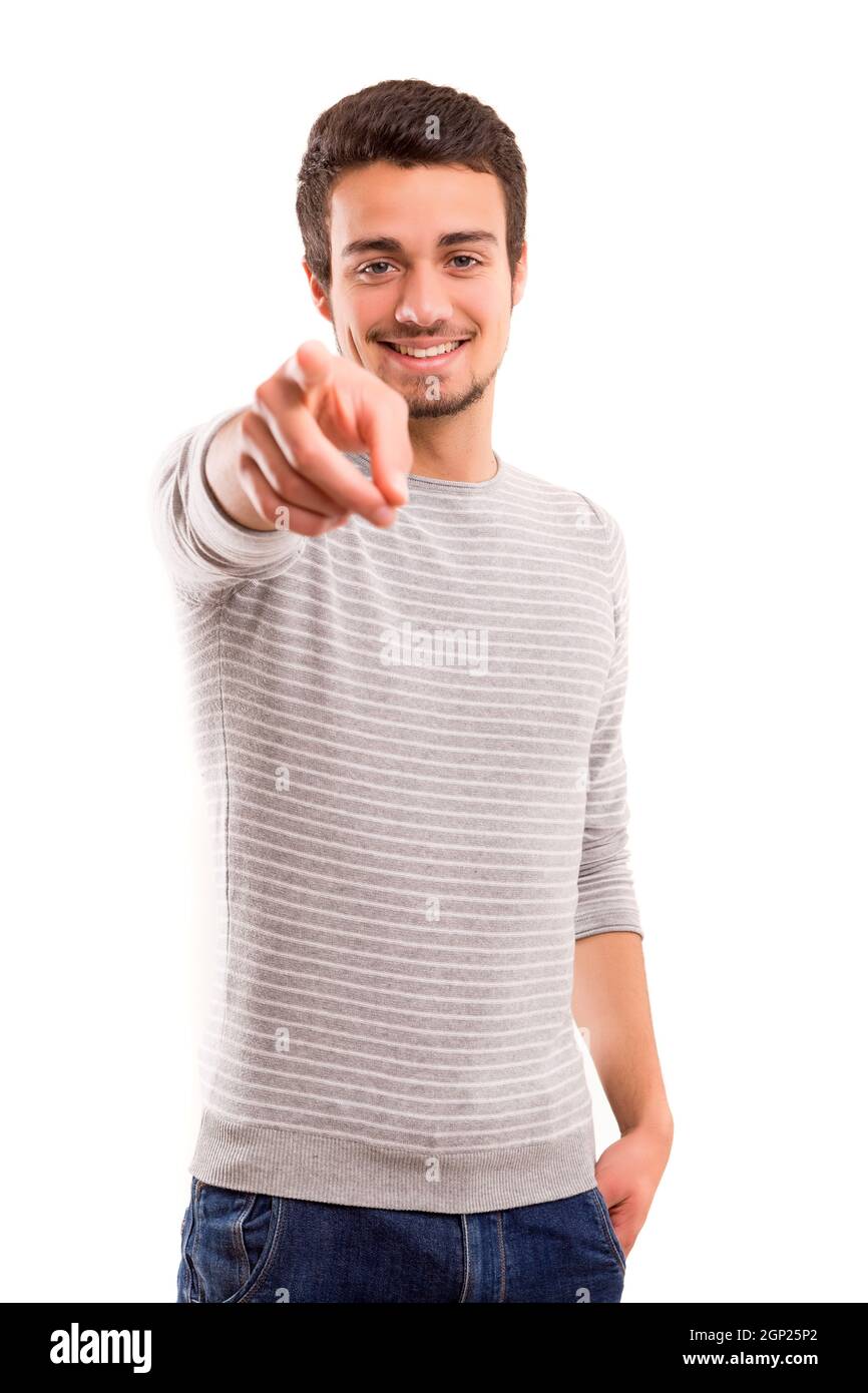 Handsome young man pointing at you, isolated over white background ...