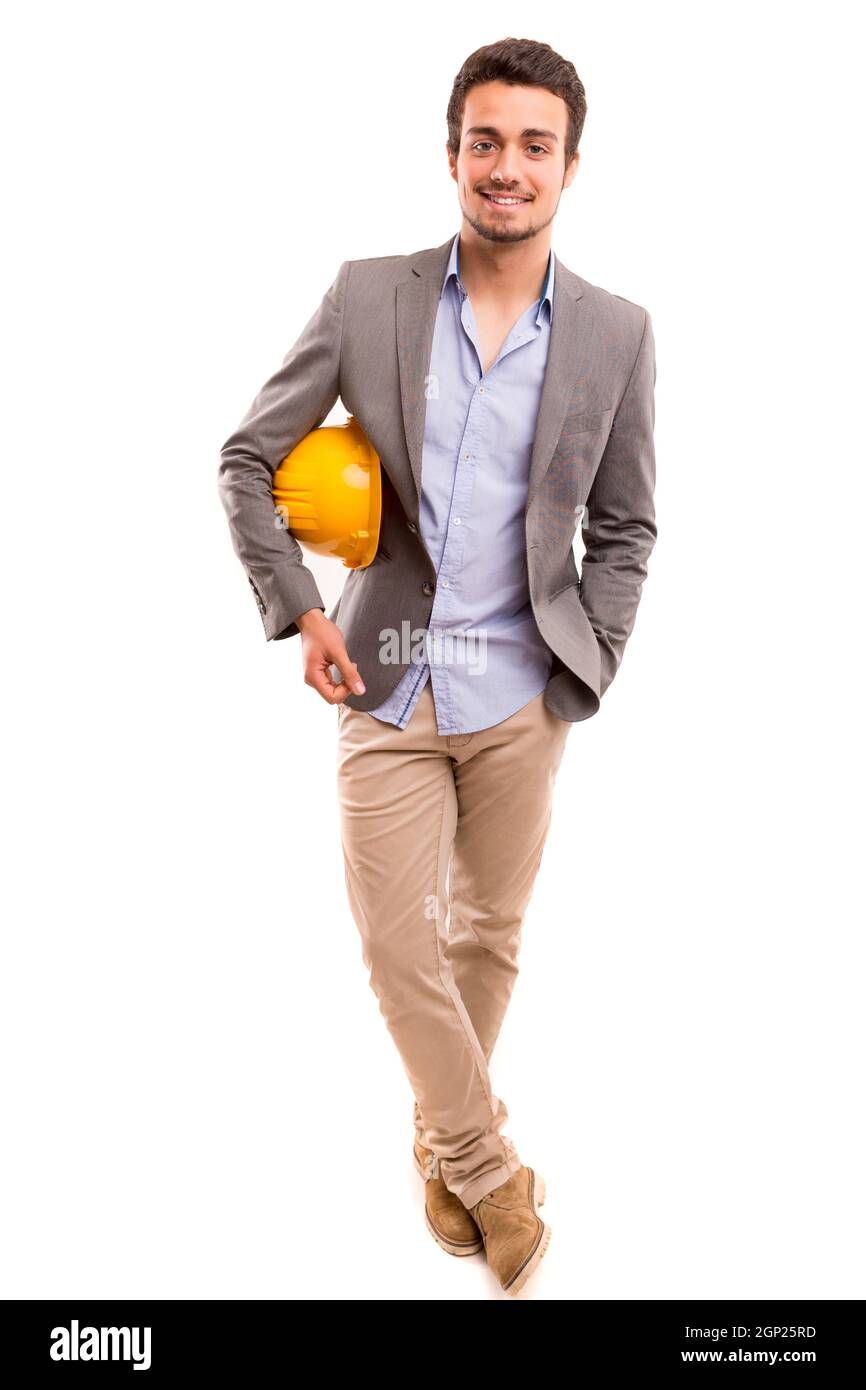 Handsome young engineer posing isolated over white background Stock ...