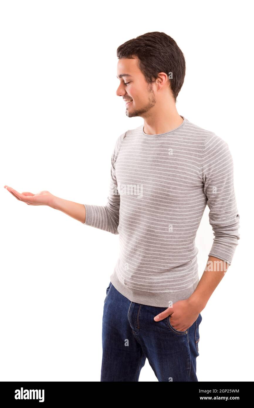 Young man presenting your product, isolated over a white background ...
