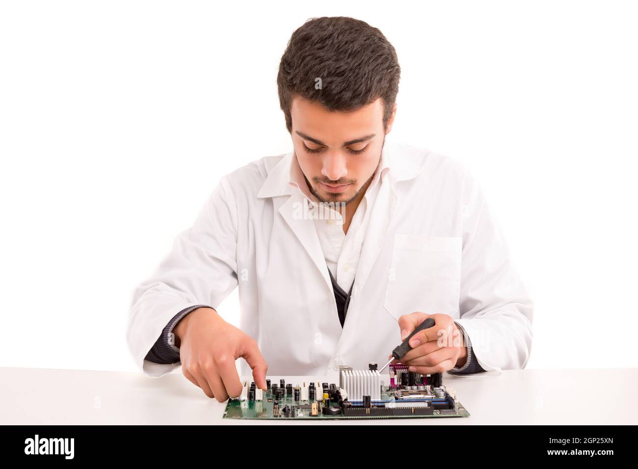 A computer engineer or technician, working on a computer motherboard ...