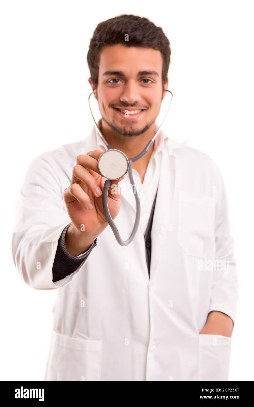 Handsome young medic holding a stethoscope, isolated over white Stock ...